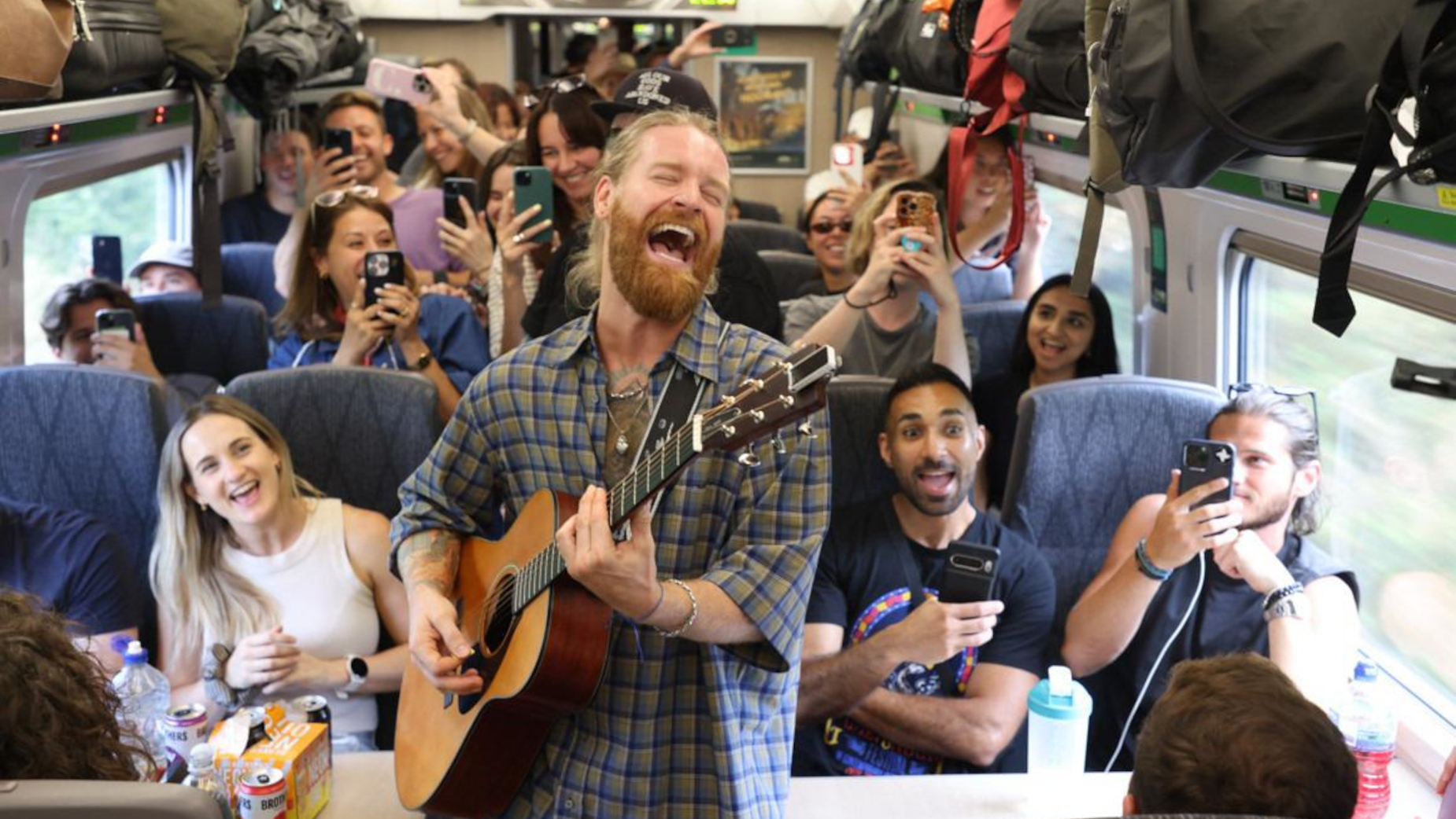 Sam Ryder Surprises Glastonbury Passengers with Train Concert | LBBOnline
