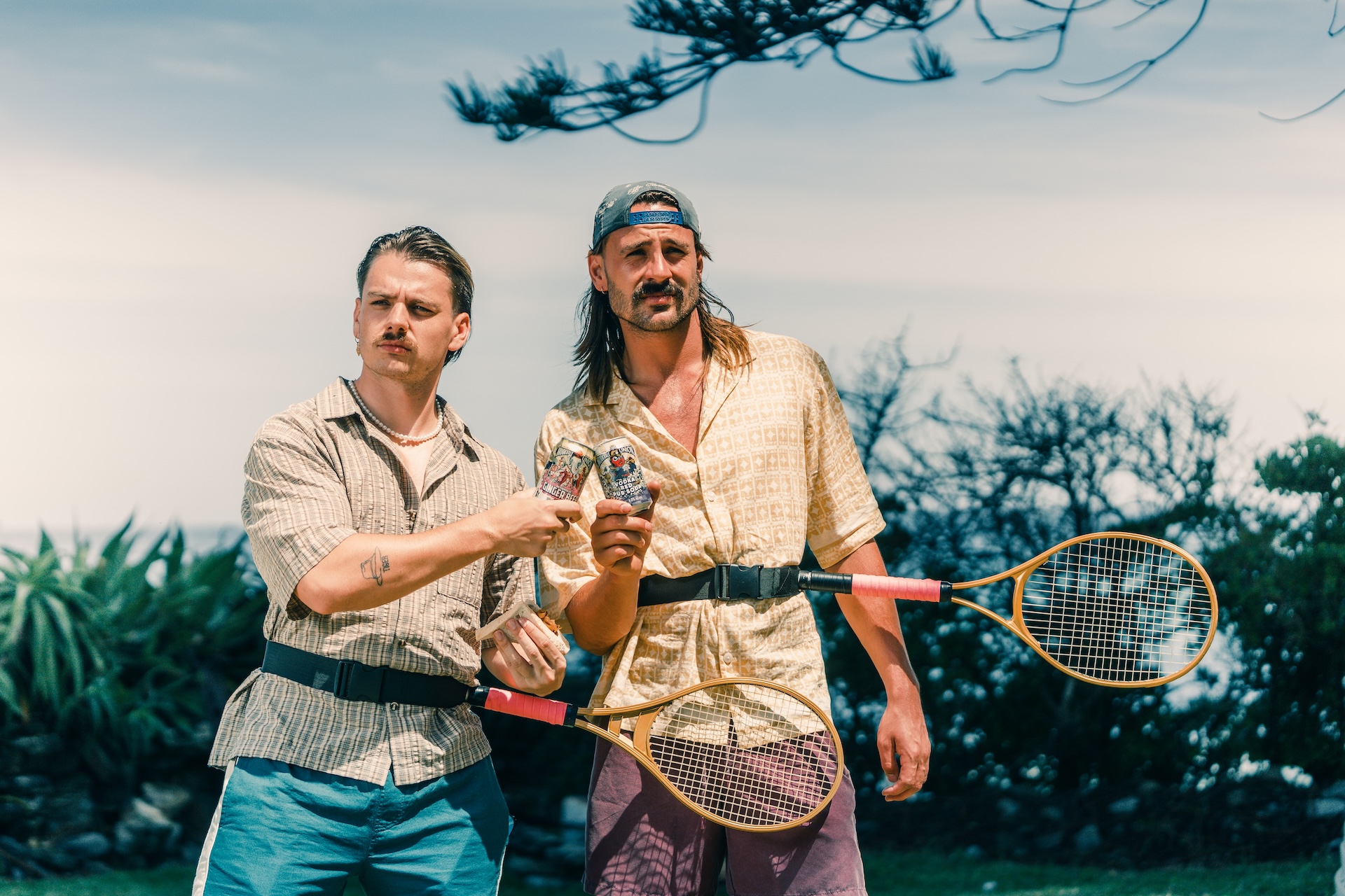 Comedians Play Tennis With Their Hips to Hold Cans of Brookvale Union ...