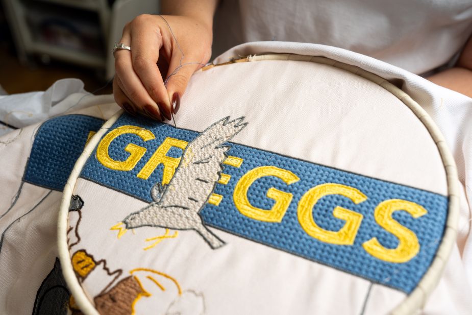 Greggs' Epic Embroidered 'Ta-Pastry' Depicts the History of the Sausage ...